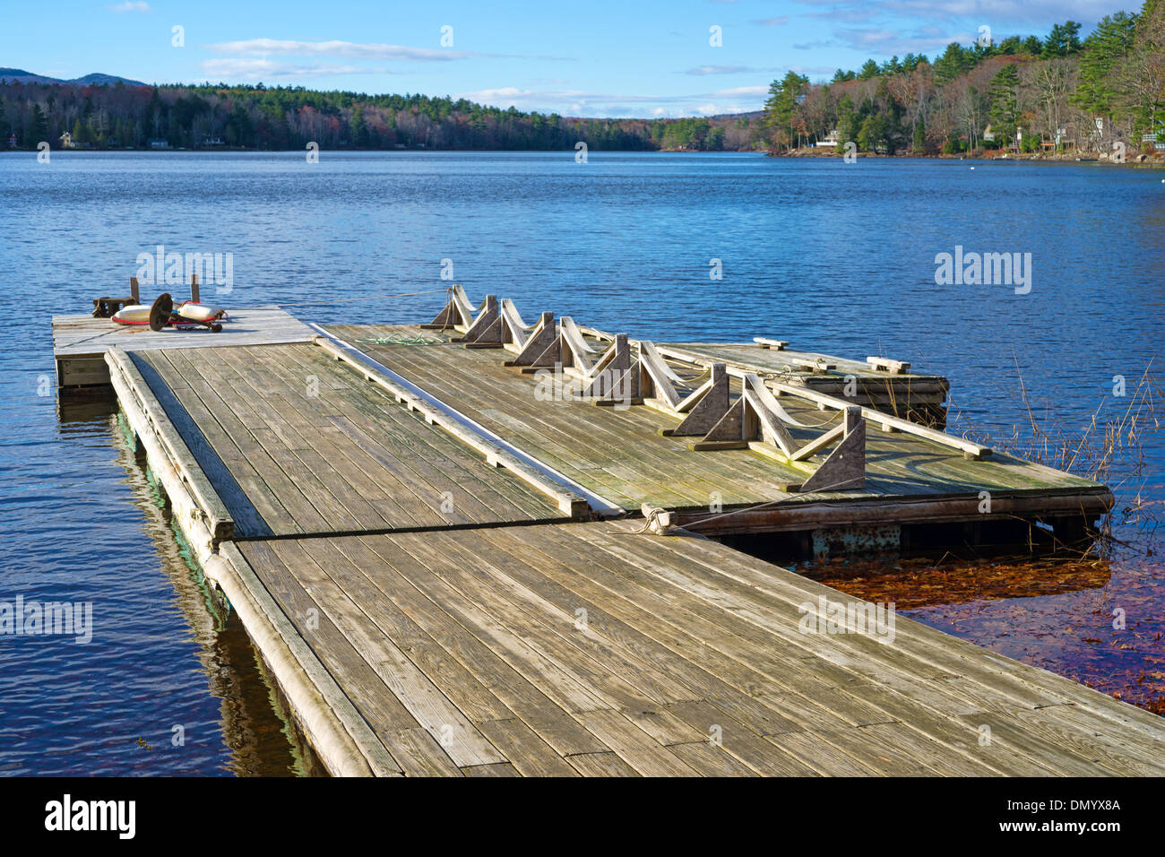 A wood floating dock that extends onto a small lake Stock Photo - Alamy