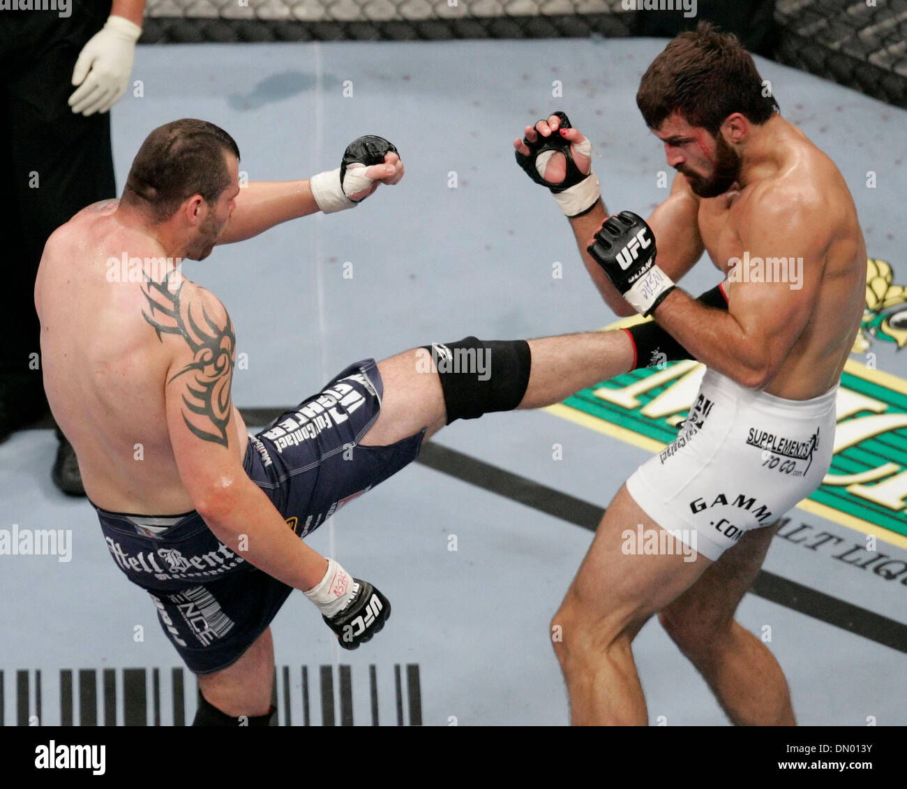 July 8, 2006: Tim Sylvia connects with a kick against Andrei Arlovski ...