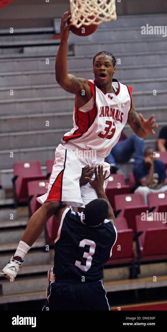 SPORTS Cardinals forward Tracy Robinson goes up and draws a blocking ...