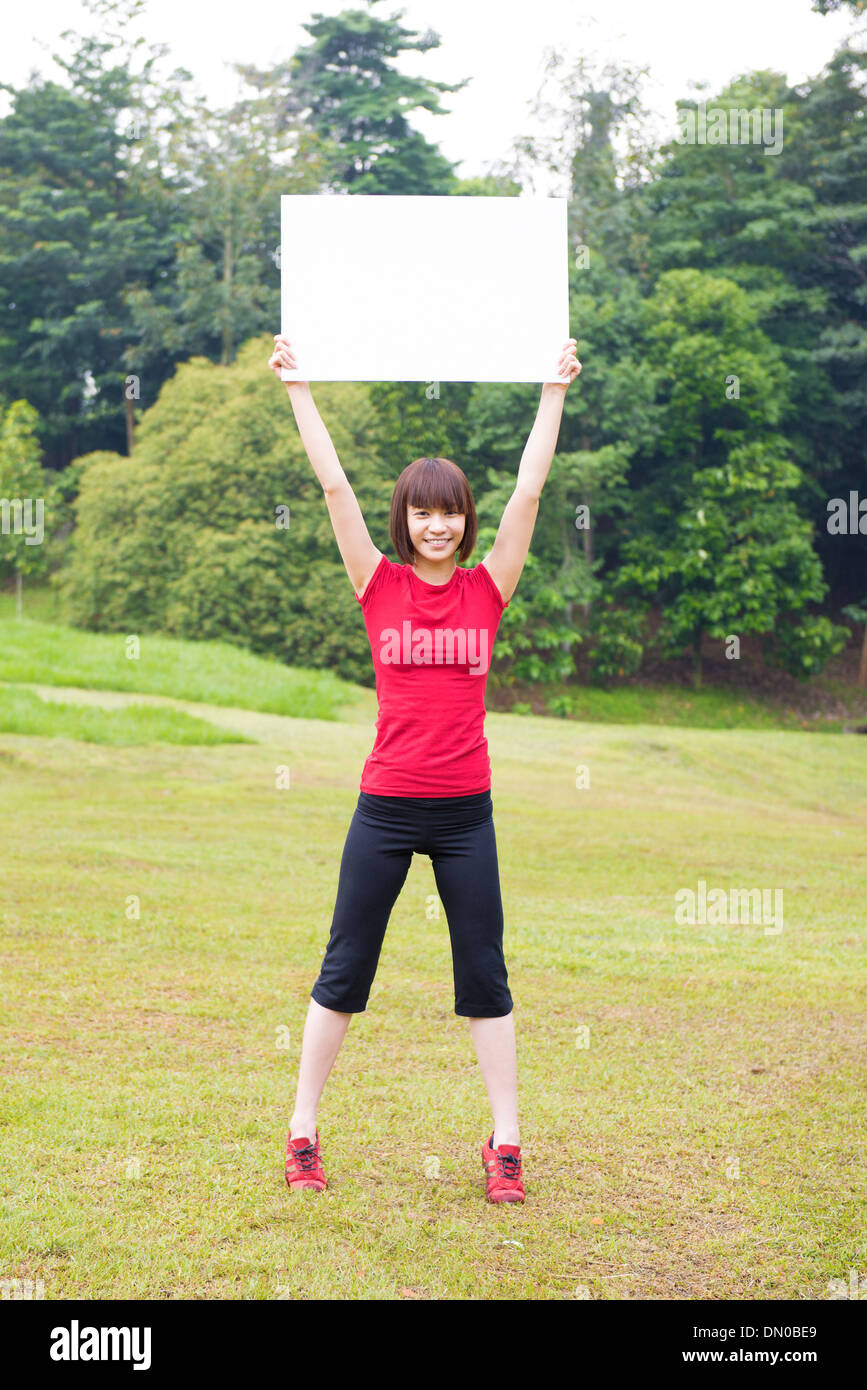 Girl holding spring poster hi-res stock photography and images - Alamy