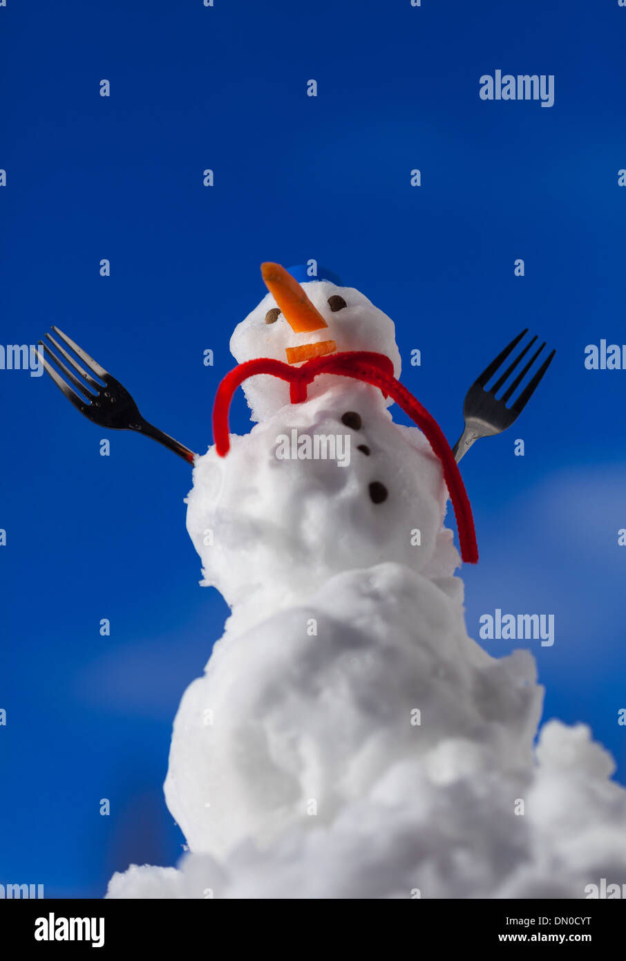 Christmas. Little funny snowman with fork as hand outdoor. Sky ...
