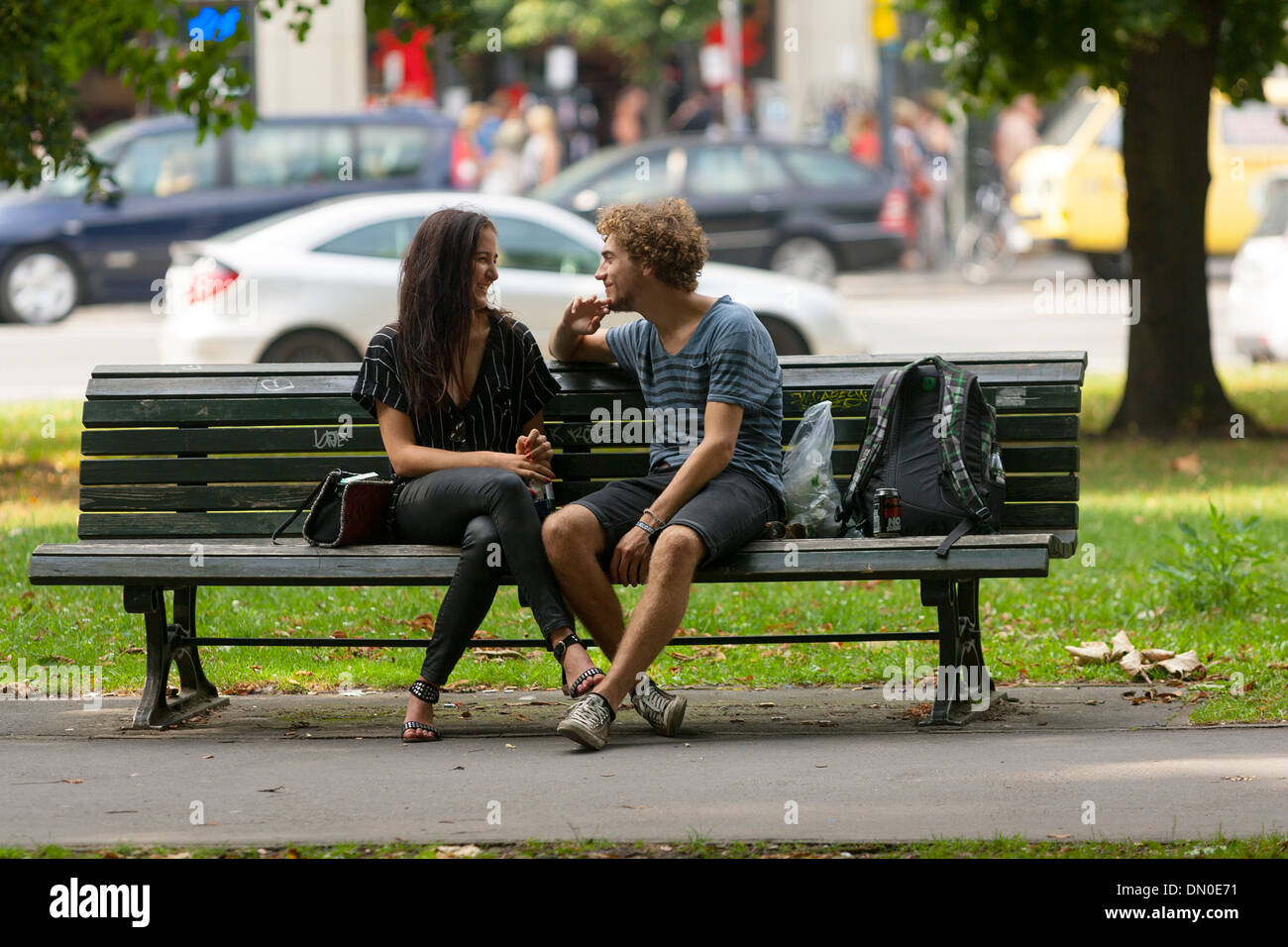 Couple sitting on the public bench. Berlin Stock Photo - Alamy