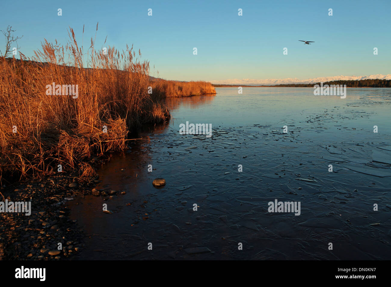 Beluga Lake near Homer Alaska on a fall evening with ice in the water ...