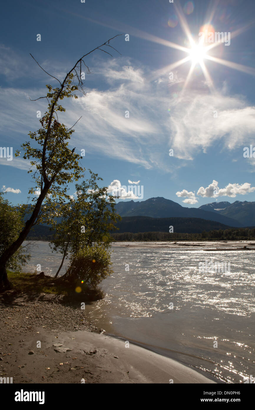 Sunburst on a sunny summer day on a beach on the Chilkat River near ...