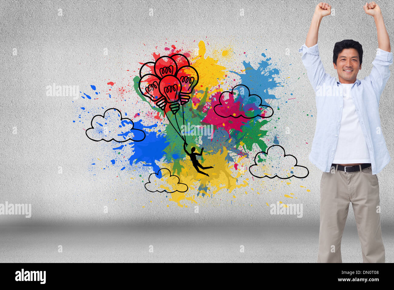Composite image of cheering male with arms up Stock Photo - Alamy