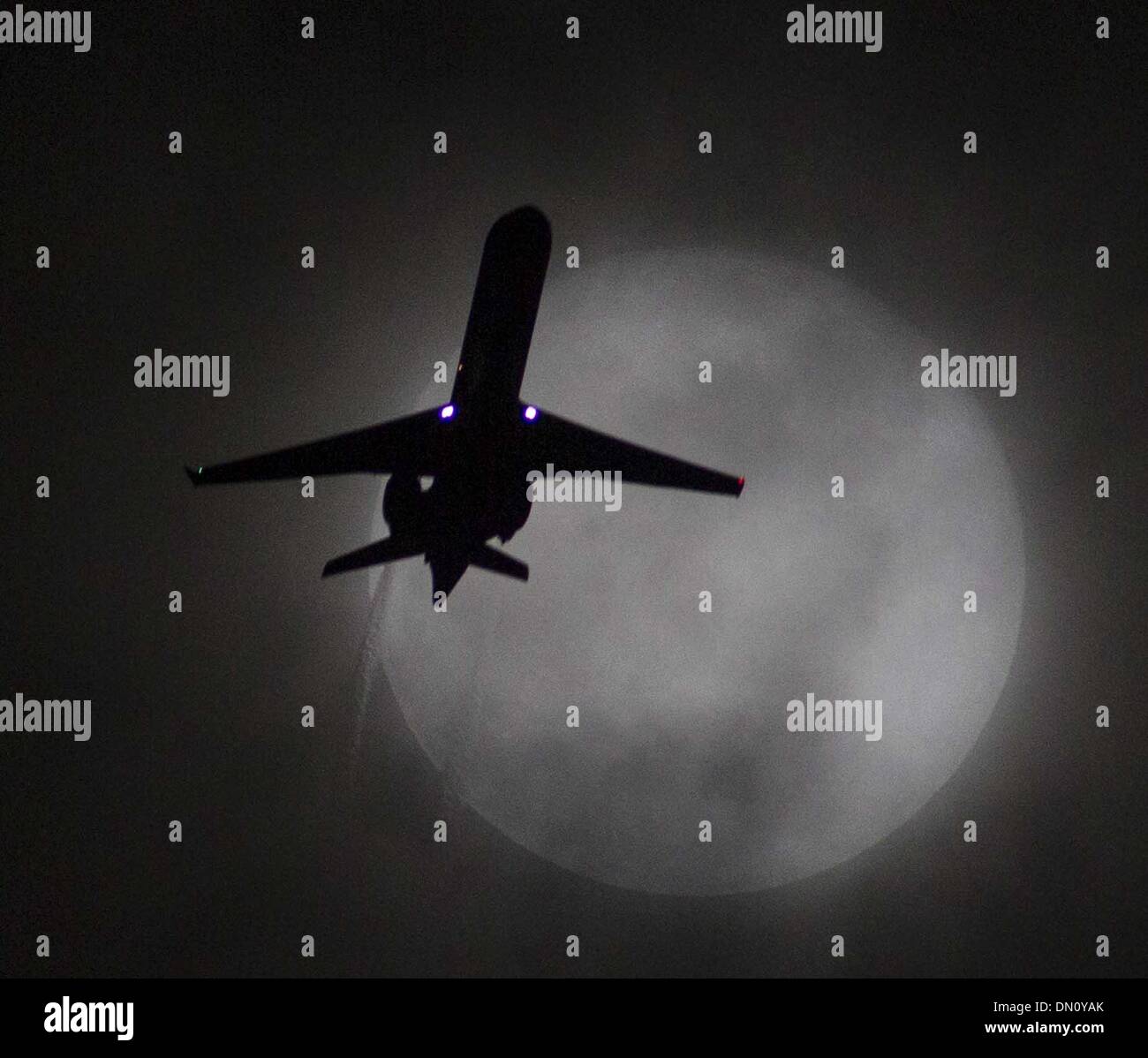 Los Angeles, California, USA. 17th Dec, 2013. A plane passes in front ...