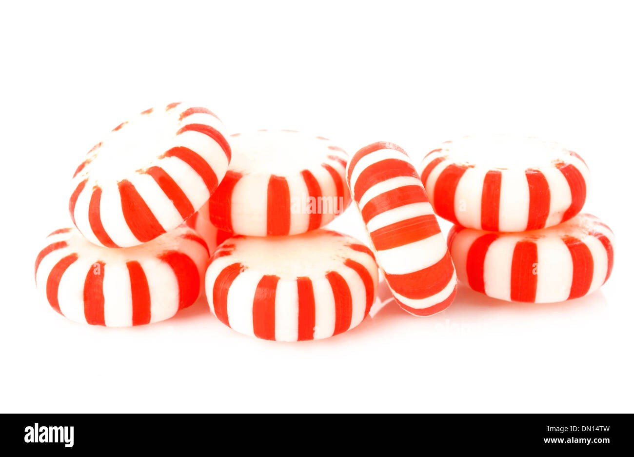 Red striped peppermints on a white background Stock Photo - Alamy