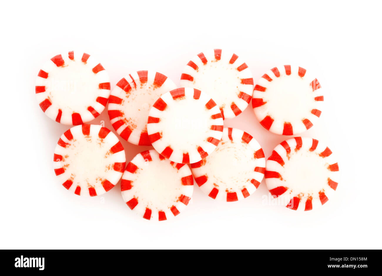 Red striped peppermints on a white background Stock Photo - Alamy