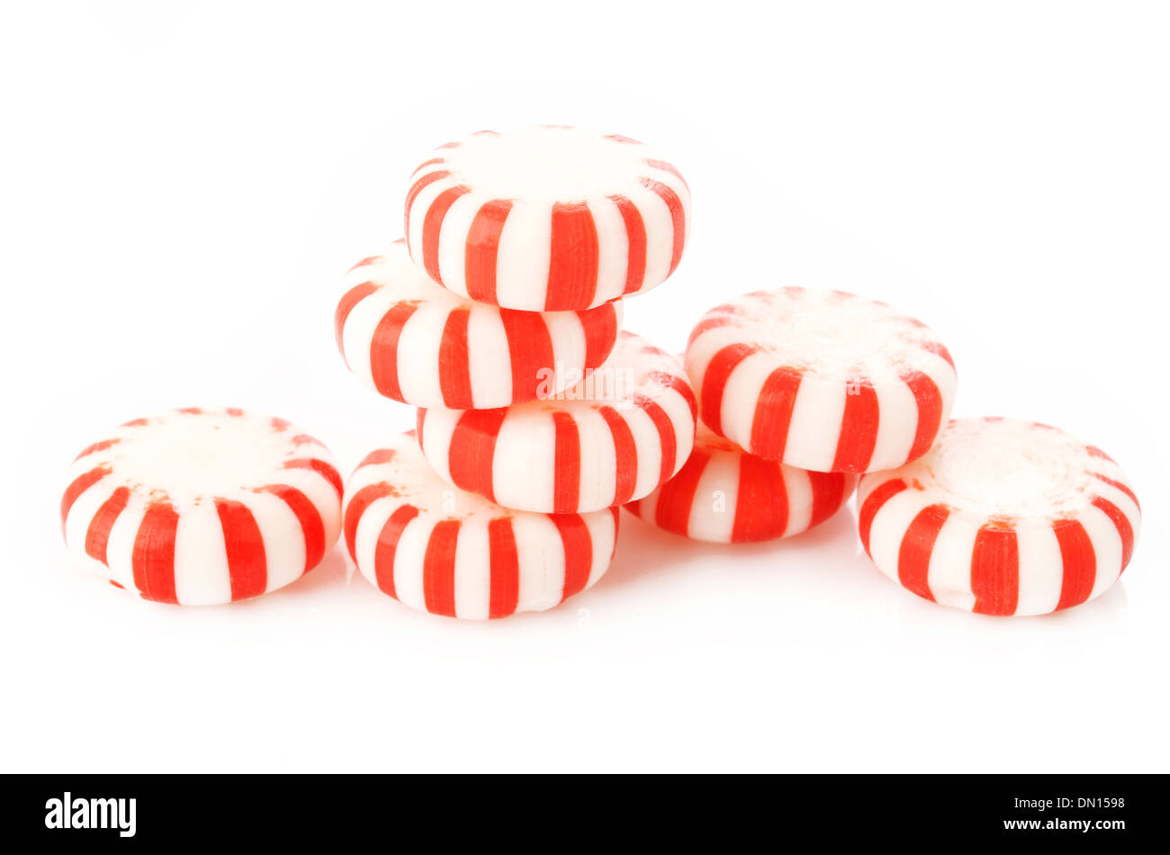 Red striped peppermints on a white background Stock Photo - Alamy