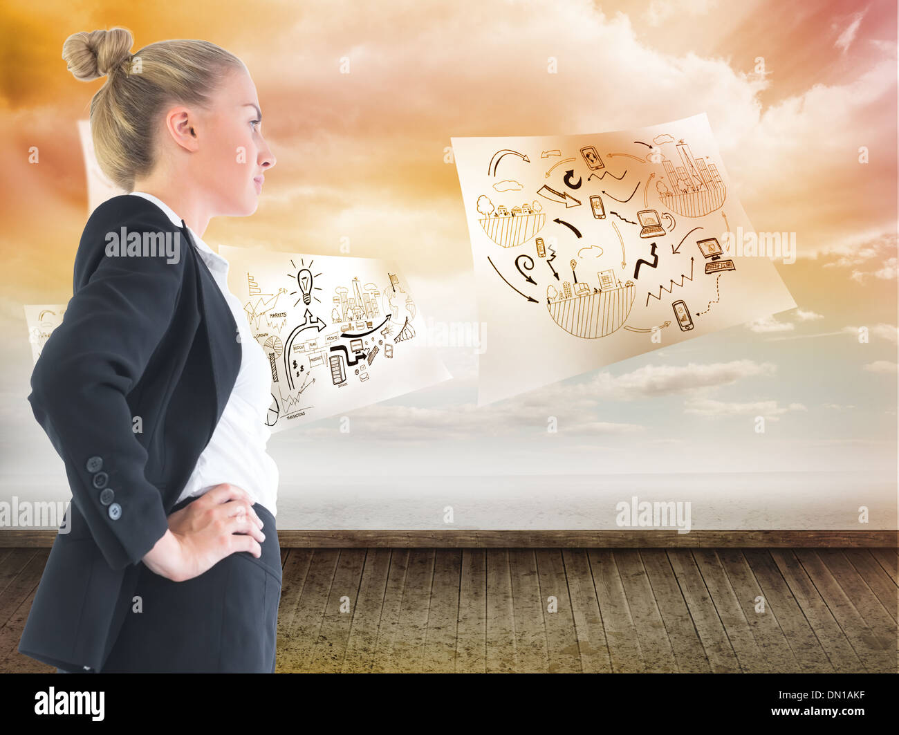Composite image of businesswoman standing with hands on hips Stock ...