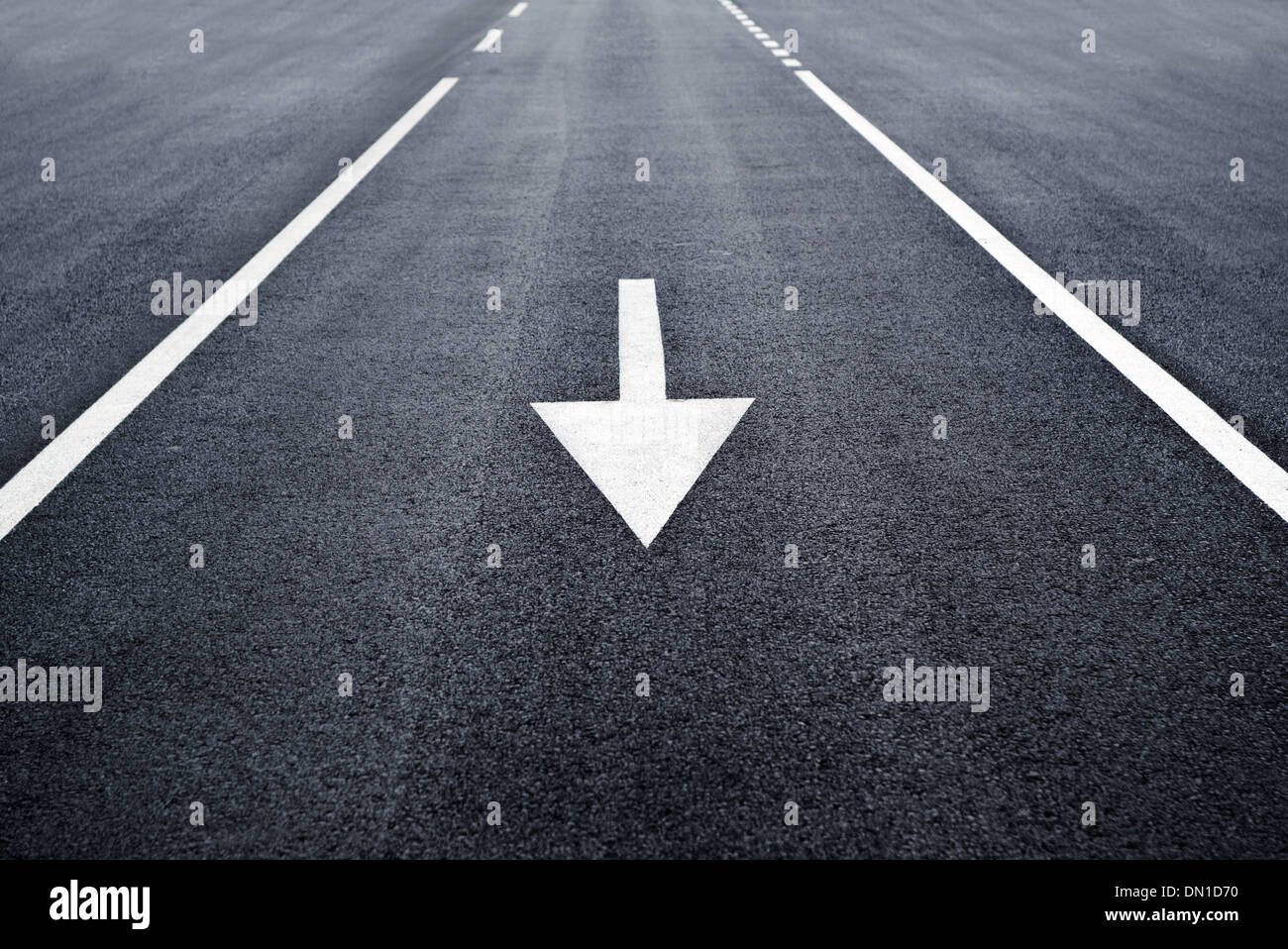 Arrow sign on asphalt surface. Arrow sign on highway road Stock Photo ...