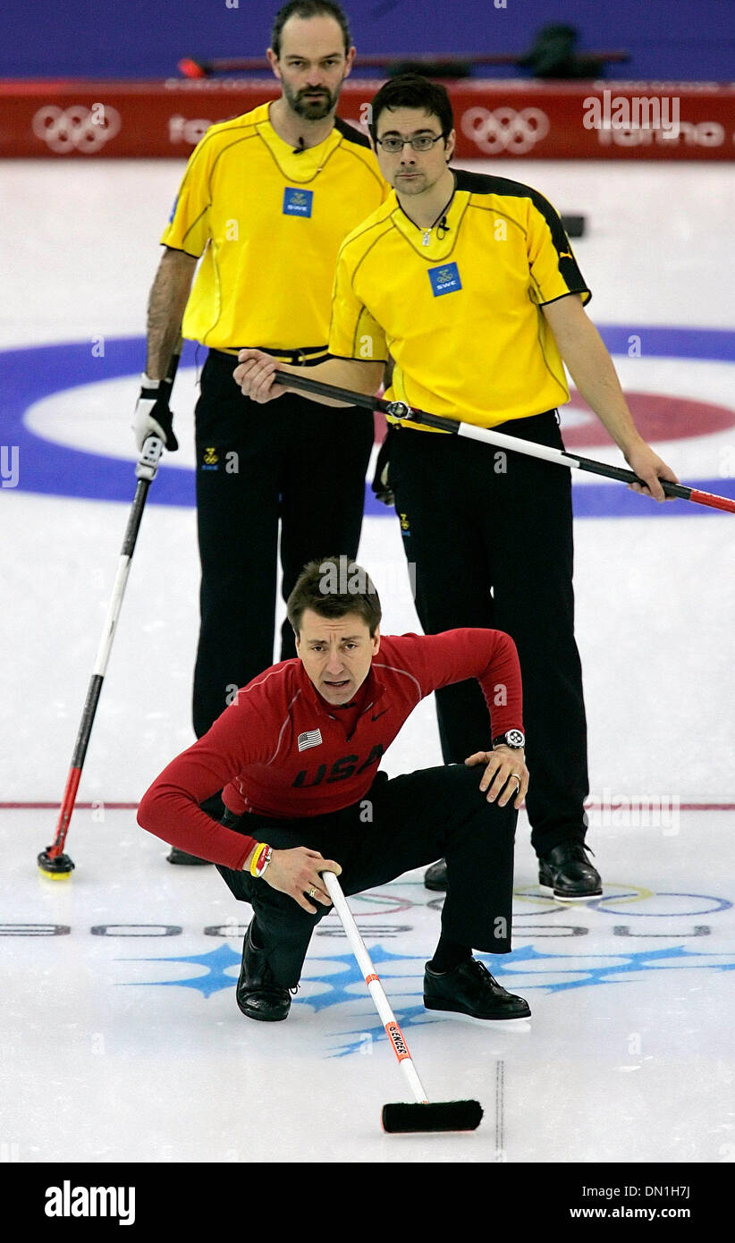 Feb 16, 2006; Turin, Peidmont, ITALY; Pete Fenson, center, watch his ...