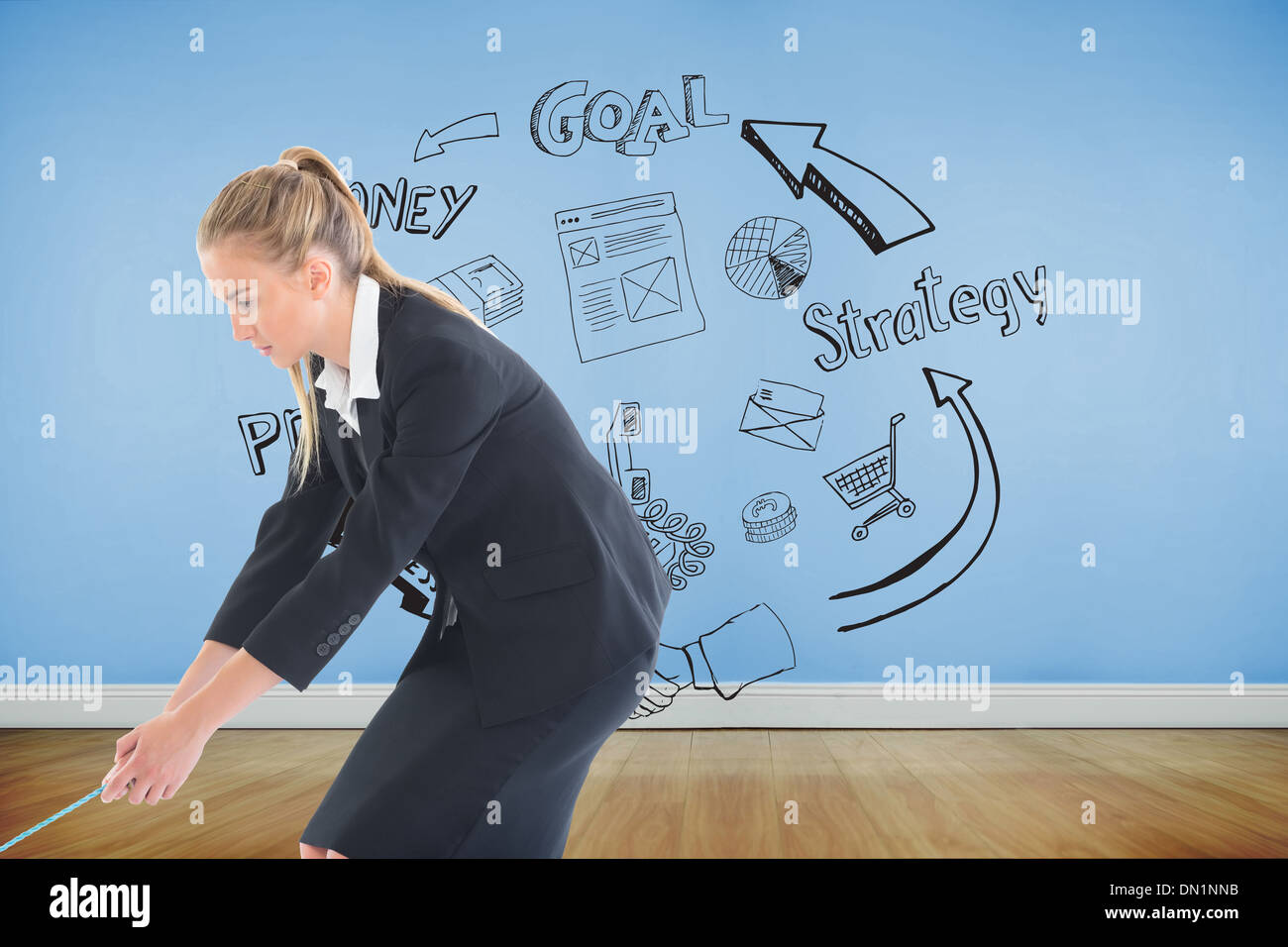 Composite image of businesswoman pulling a rope Stock Photo - Alamy