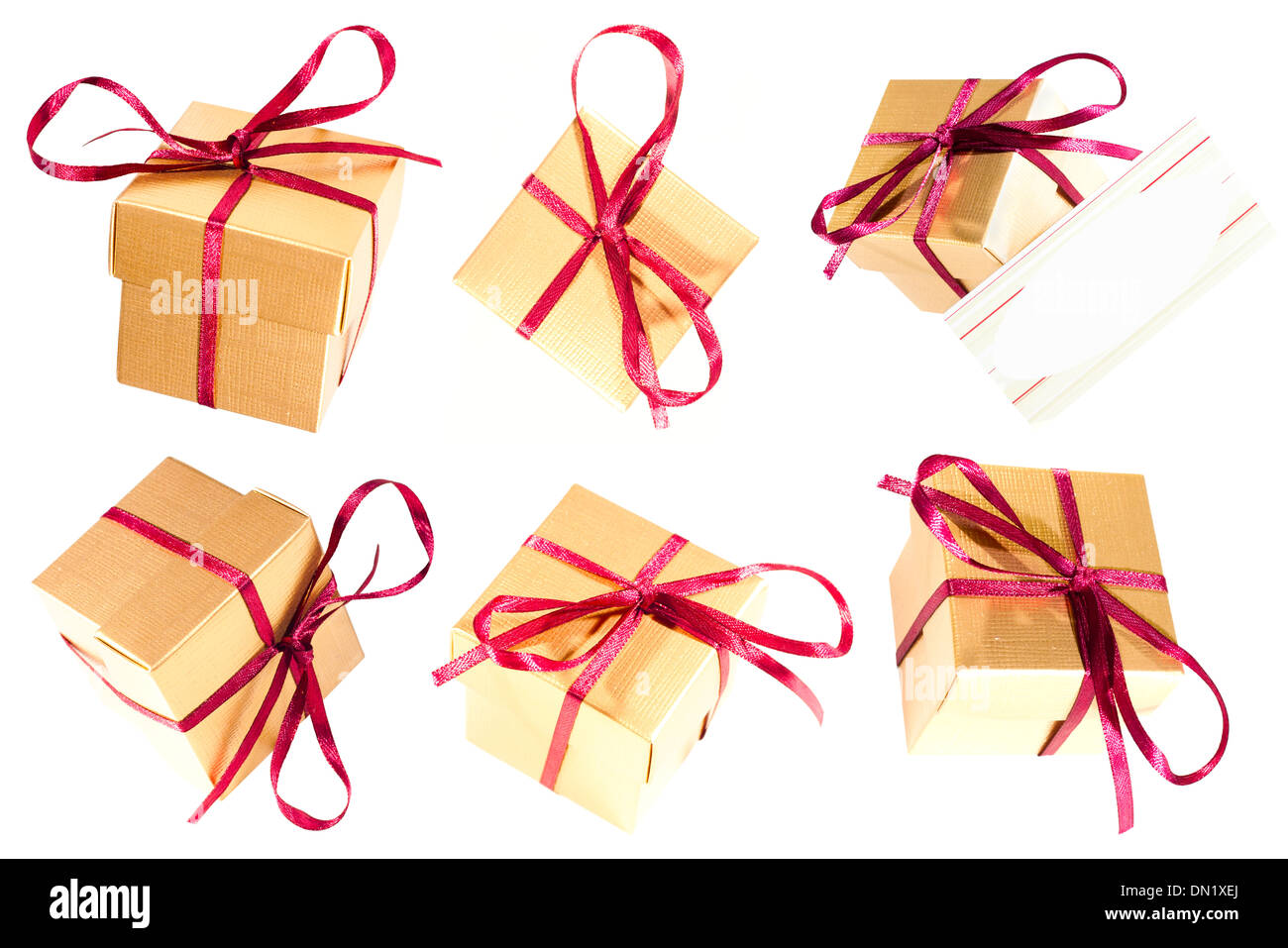 Set of golden isolated gift boxes with red ribbon Stock Photo - Alamy