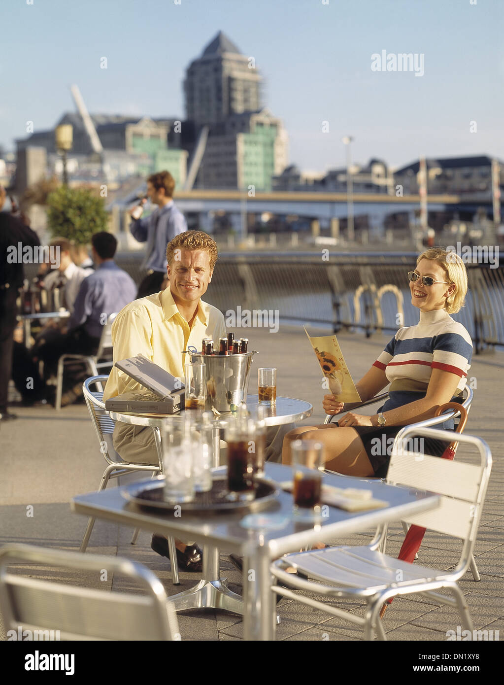 Couple drinking outside Stock Photo - Alamy
