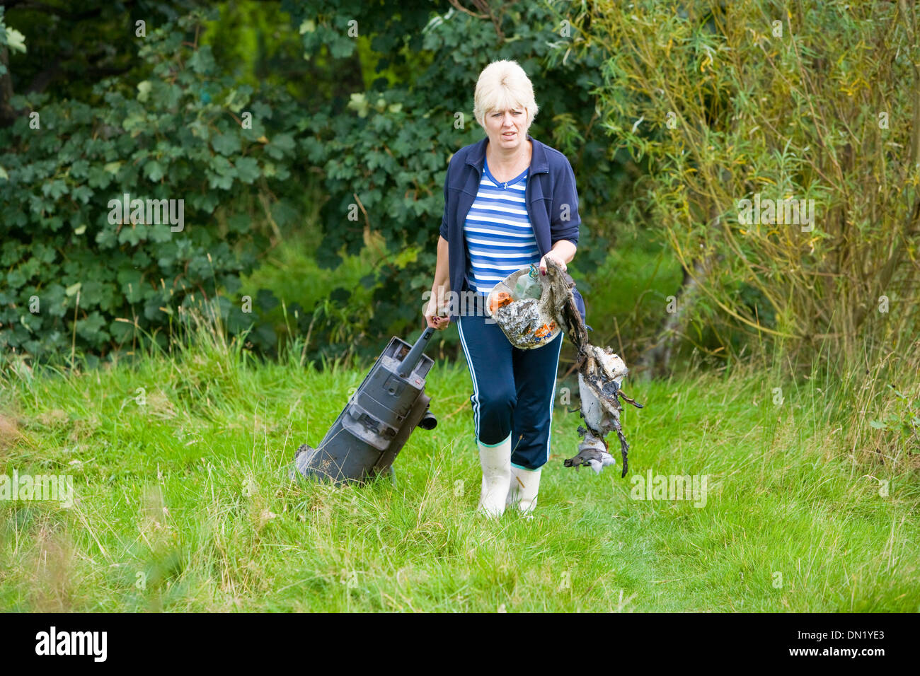 removing rubbish from a pond Stock Photo - Alamy