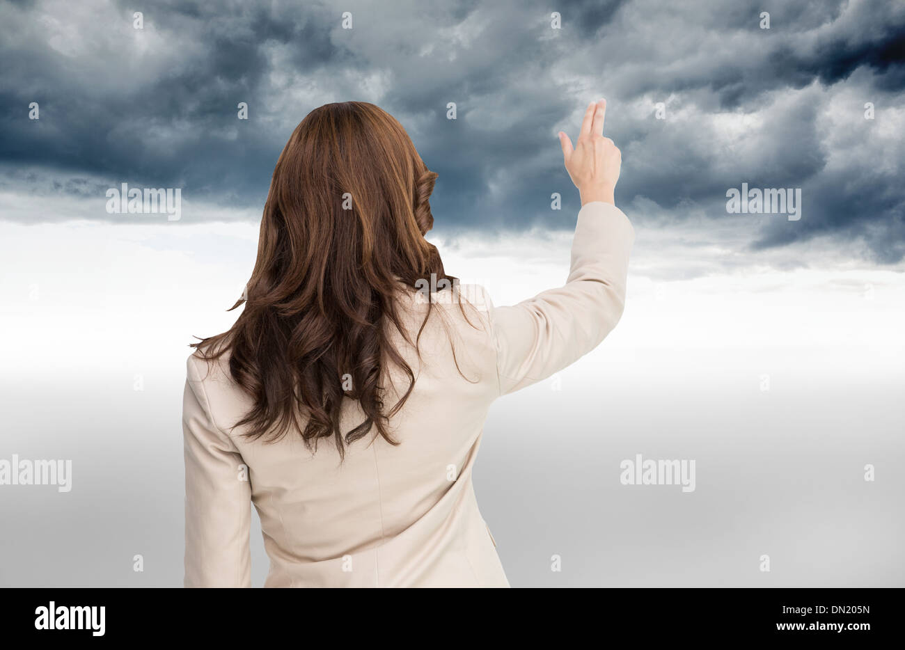 Composite image of brunette businesswoman standing back to camera Stock ...
