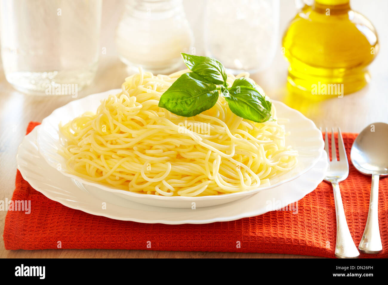 Pure original Italian spaghetti with decoration of basil Stock Photo ...