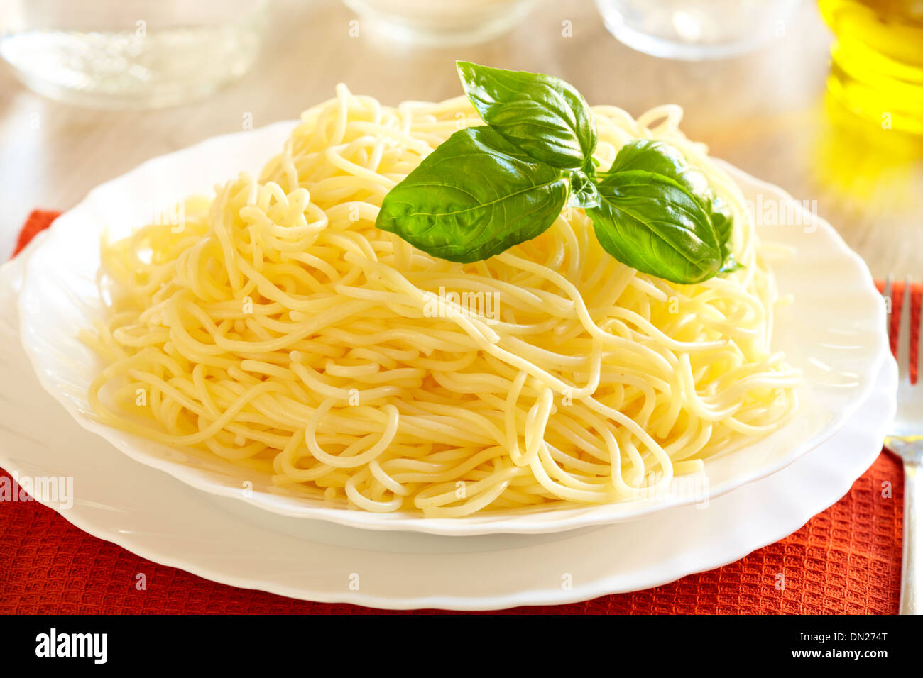 Pure original Italian spaghetti with decoration of basil Stock Photo ...