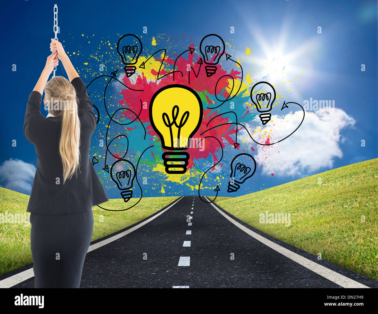 Composite image of businesswoman pulling a chain Stock Photo - Alamy