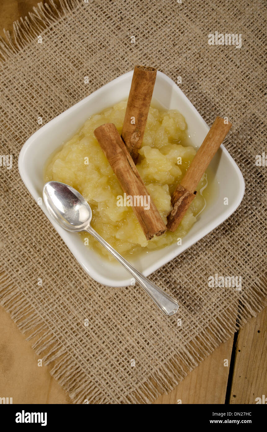 home made apple compote, cinnamon and a spoon Stock Photo - Alamy