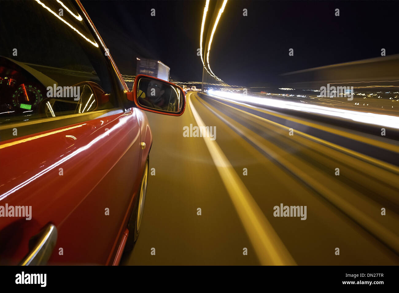 A man driving a car at night on a busy motorway Stock Photo - Alamy