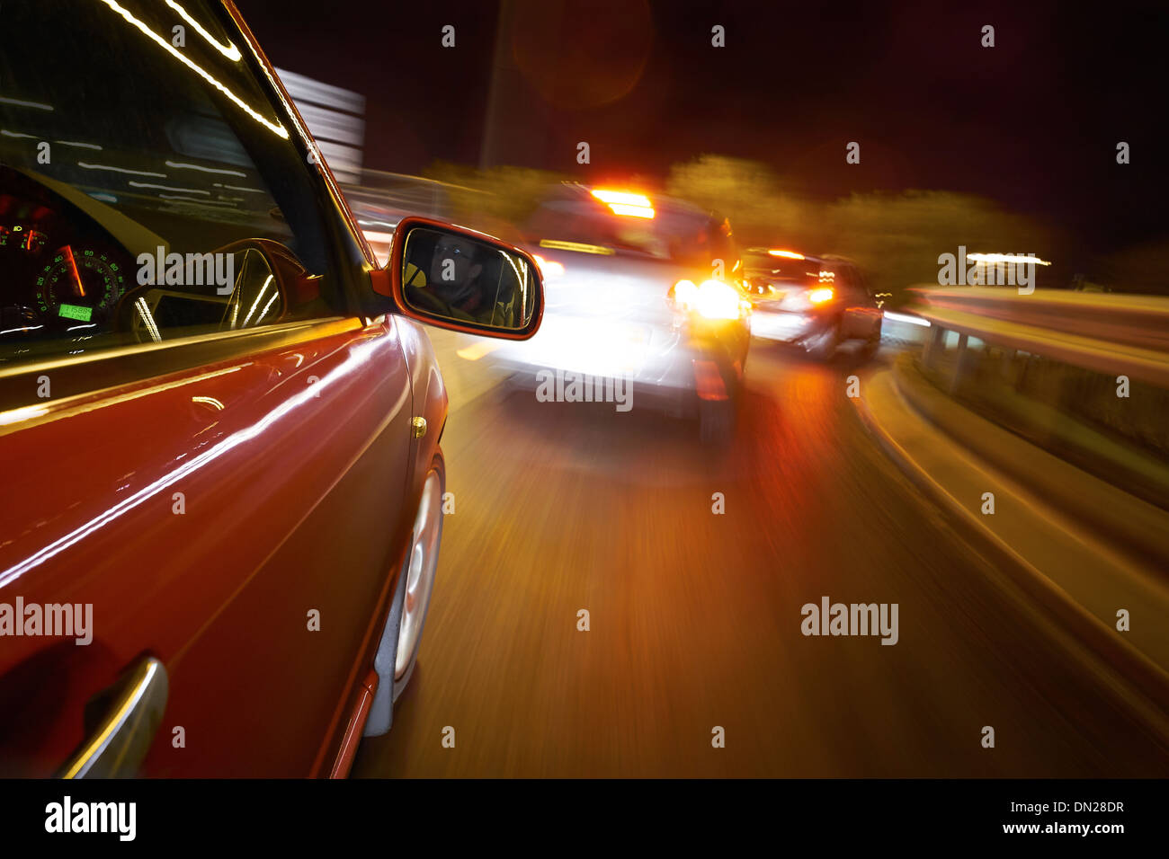 A man driving a car at night on a straight road Stock Photo - Alamy
