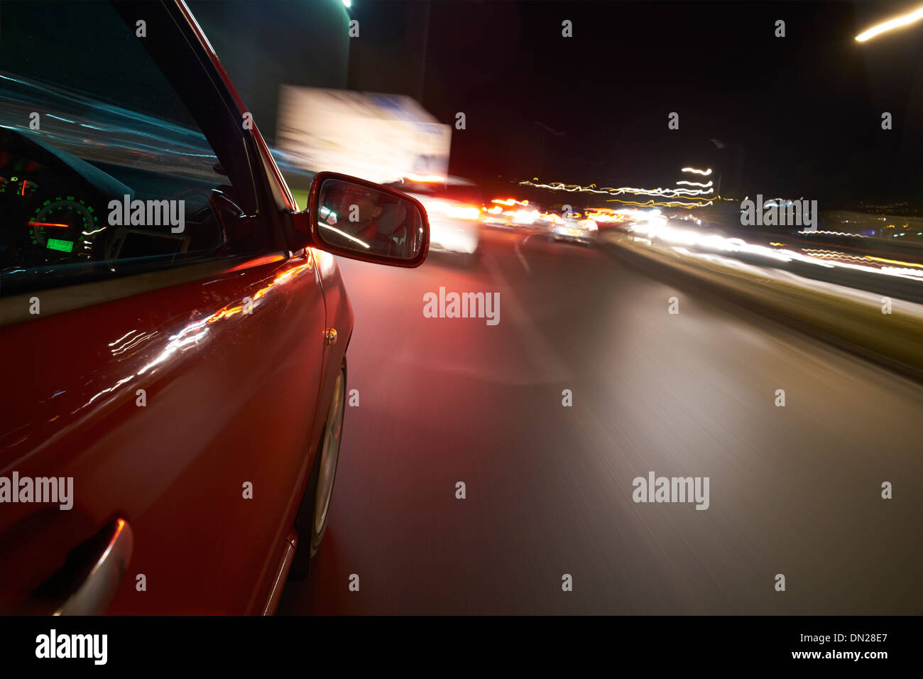 Red cars driving on straight hi-res stock photography and images - Alamy