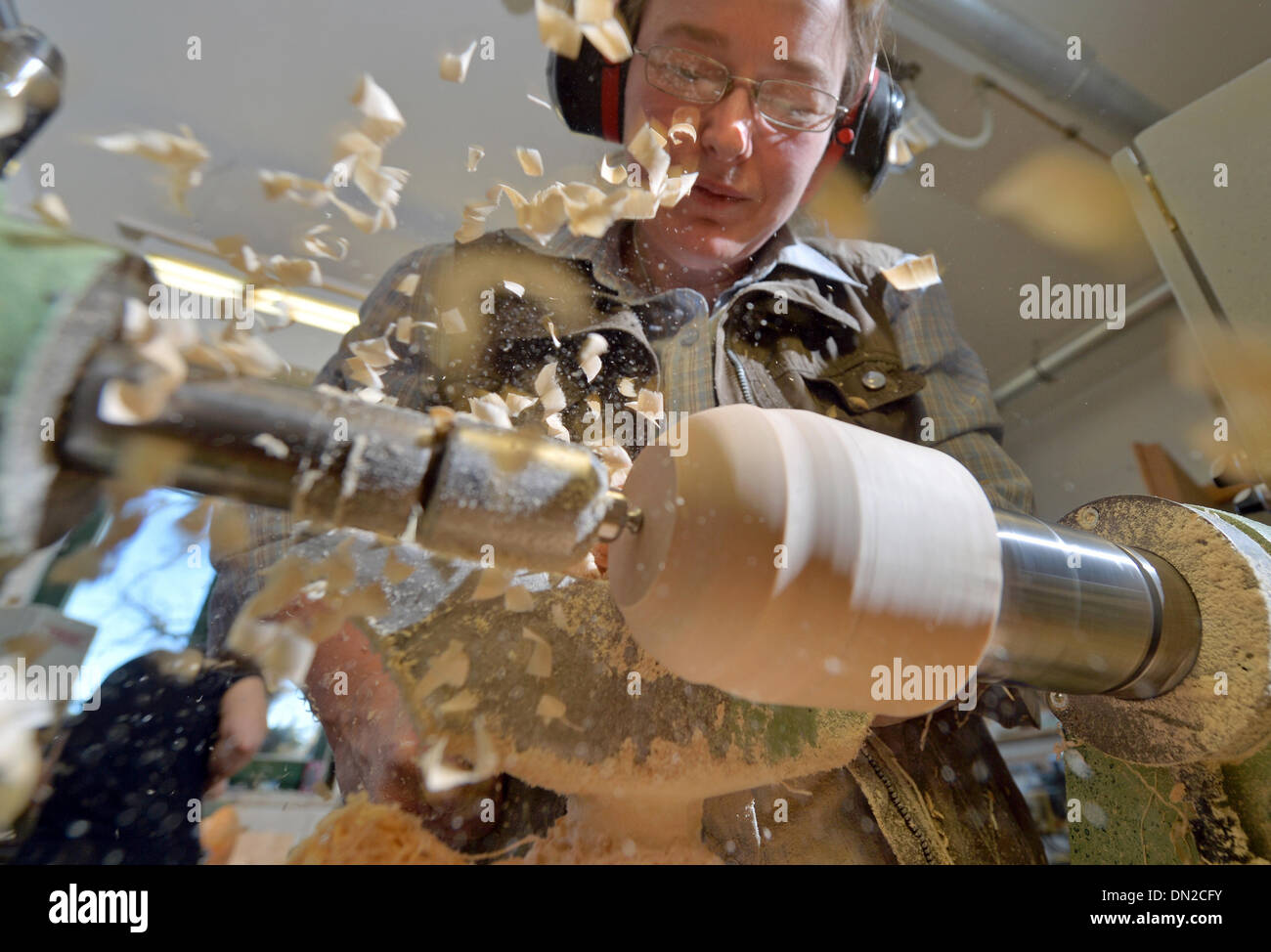 Eppendorf, Germany. 13th Dec, 2013. Wooden toymaker Angela Berger works ...