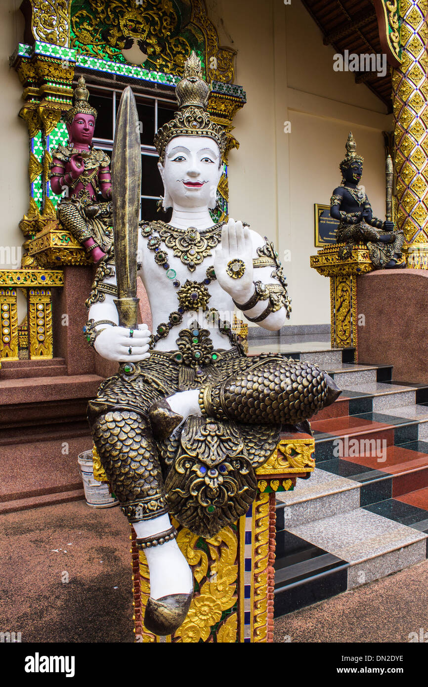 Thai angels with swords in Temple Stock Photo - Alamy