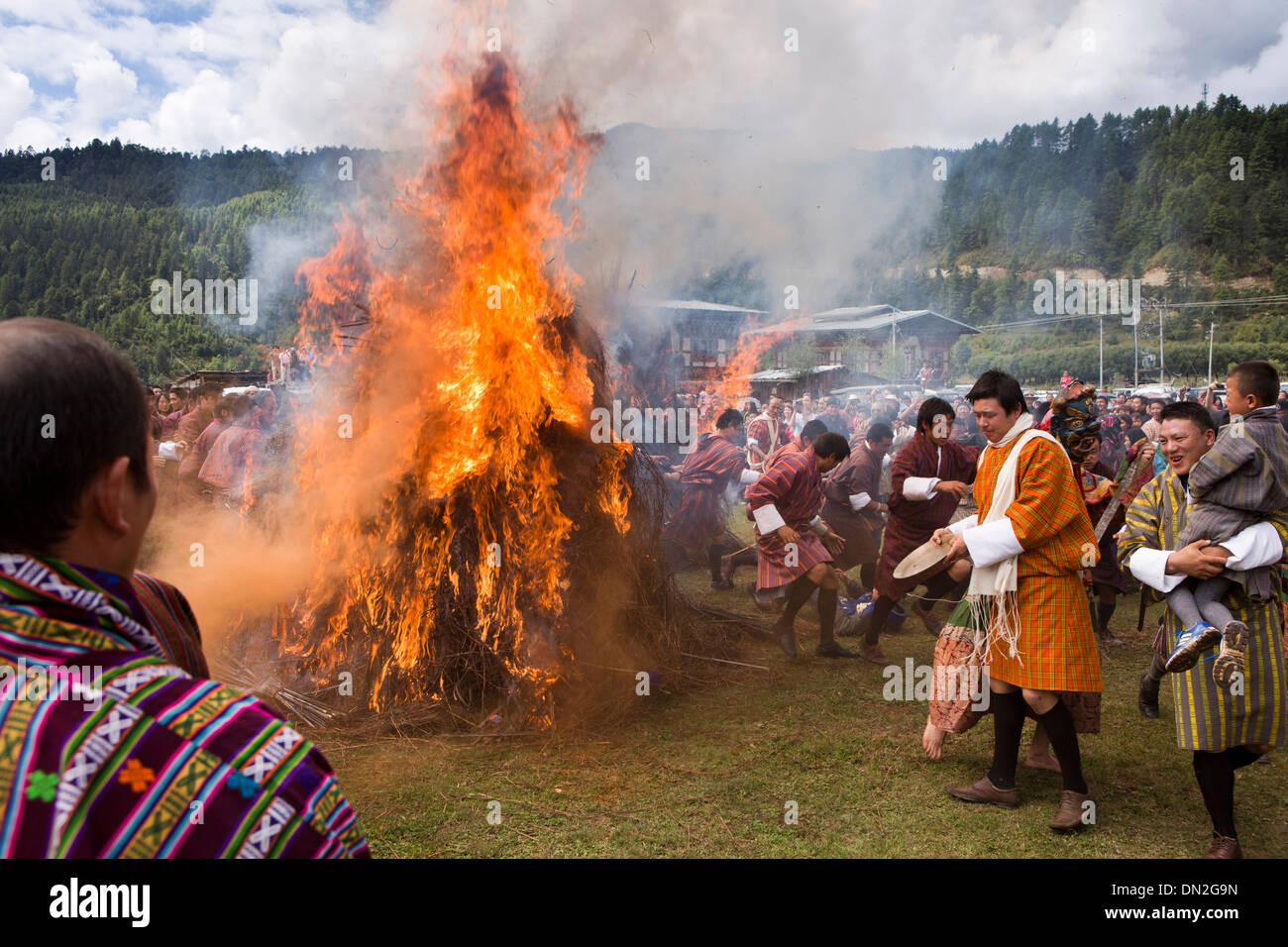 Bhutan, Thangbi Lhakang Mewang, fire blessing ceremony nmen running ...