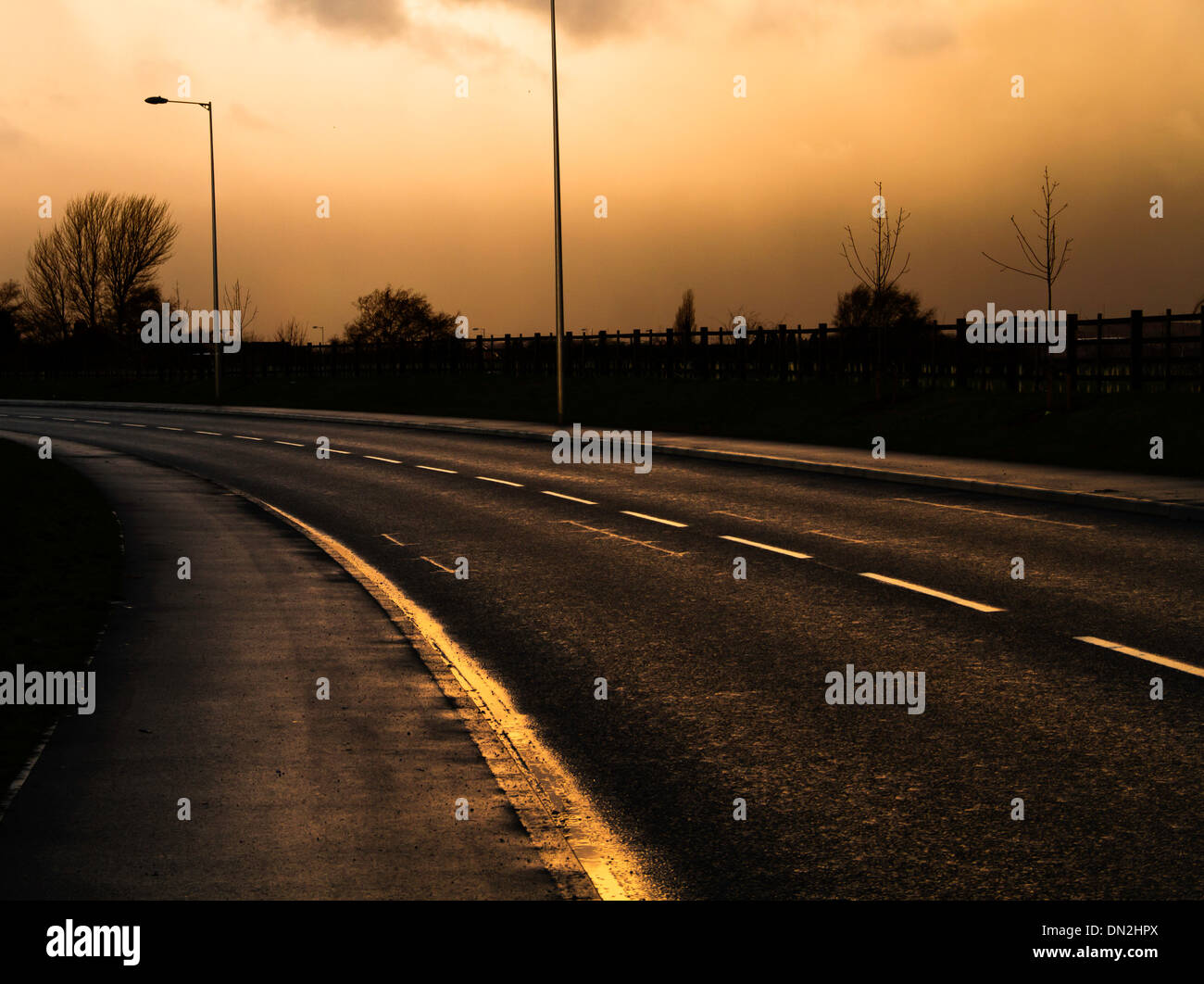 Empty road at sunrise hi-res stock photography and images - Alamy