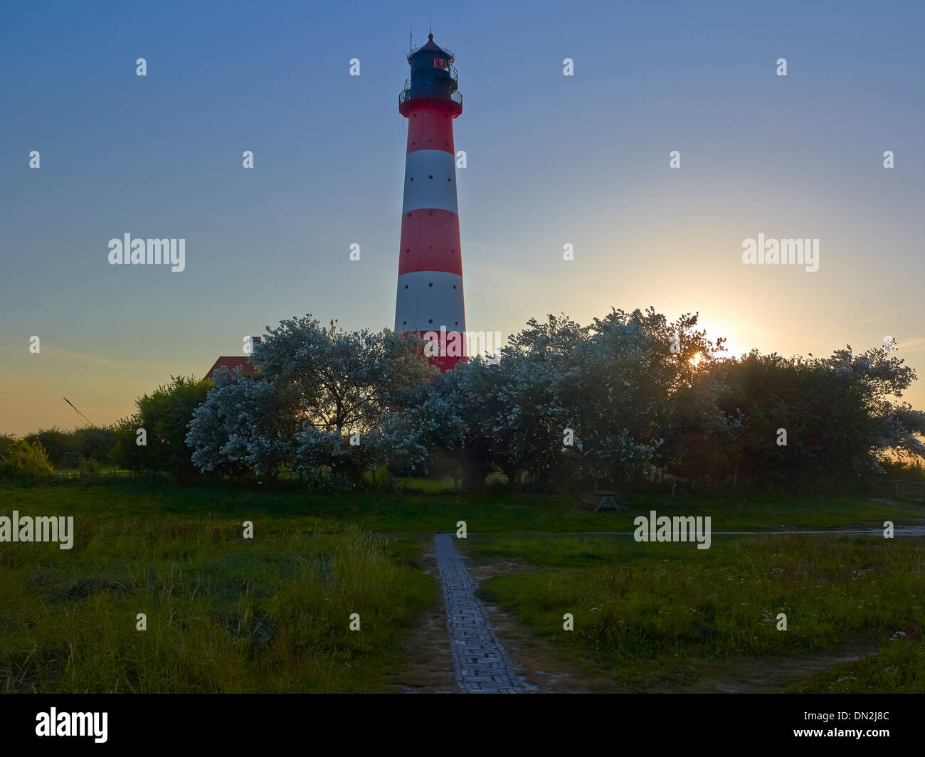 Lighthouse Westerheversand in backlight, Eiderstedt peninsula, North ...