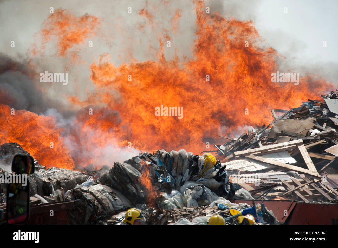 Flames fire rubbish fire waste big Stock Photo - Alamy