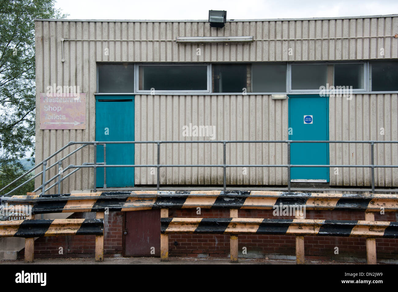 Dull Grey depressing factory doors Stock Photo - Alamy