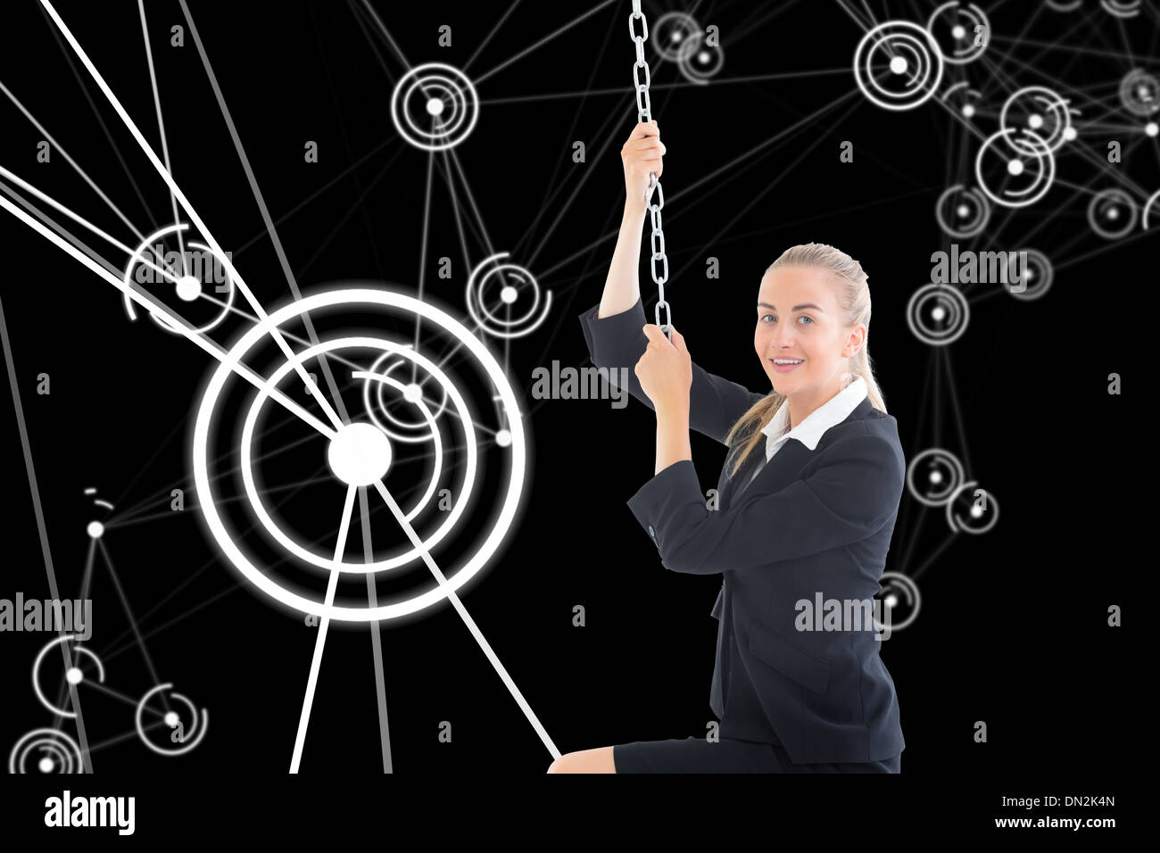 Composite image of businesswoman pulling a chain Stock Photo - Alamy