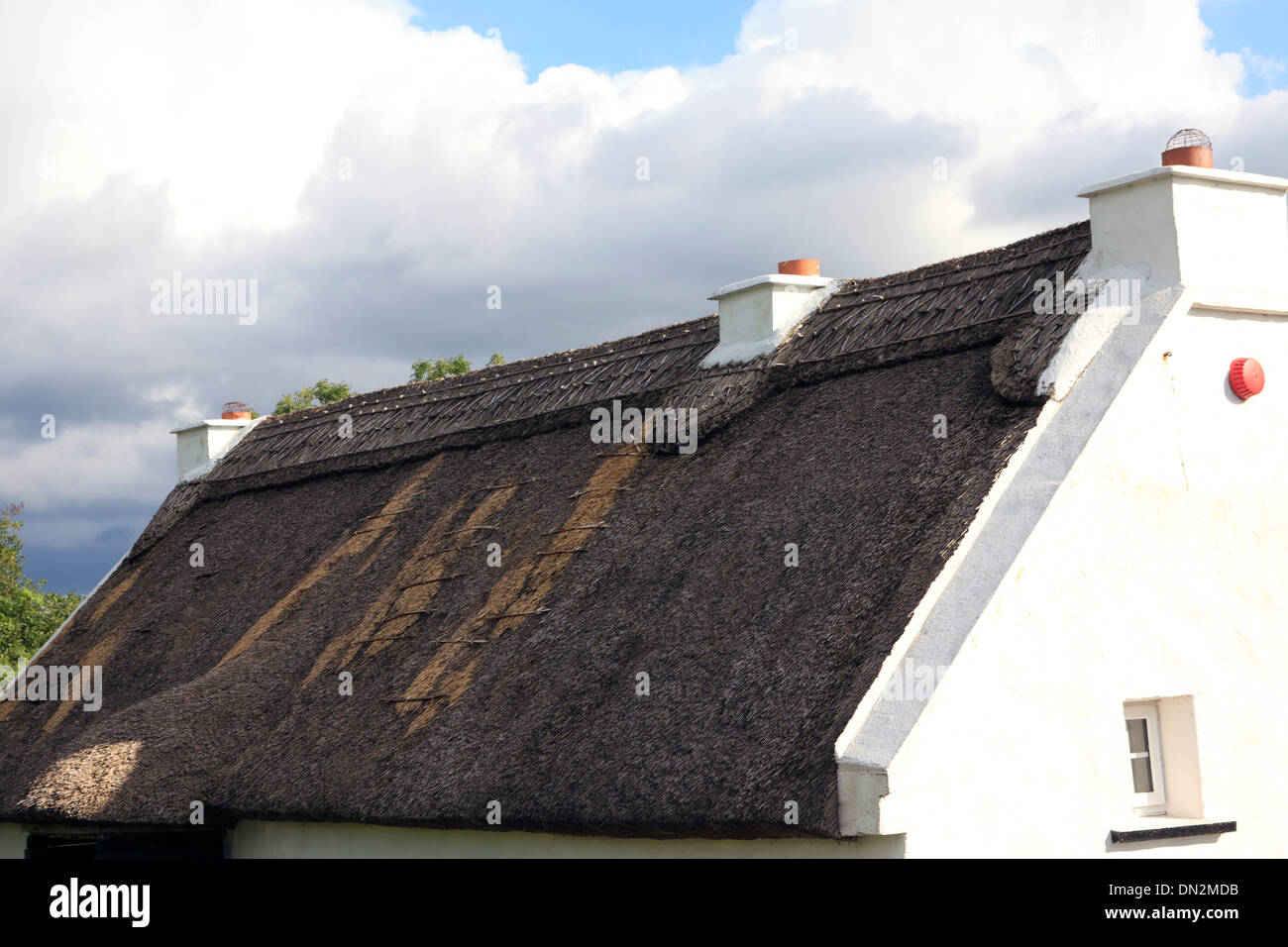 Traditional Old Irish Cottage with a thatched roof in Connemara, Co ...