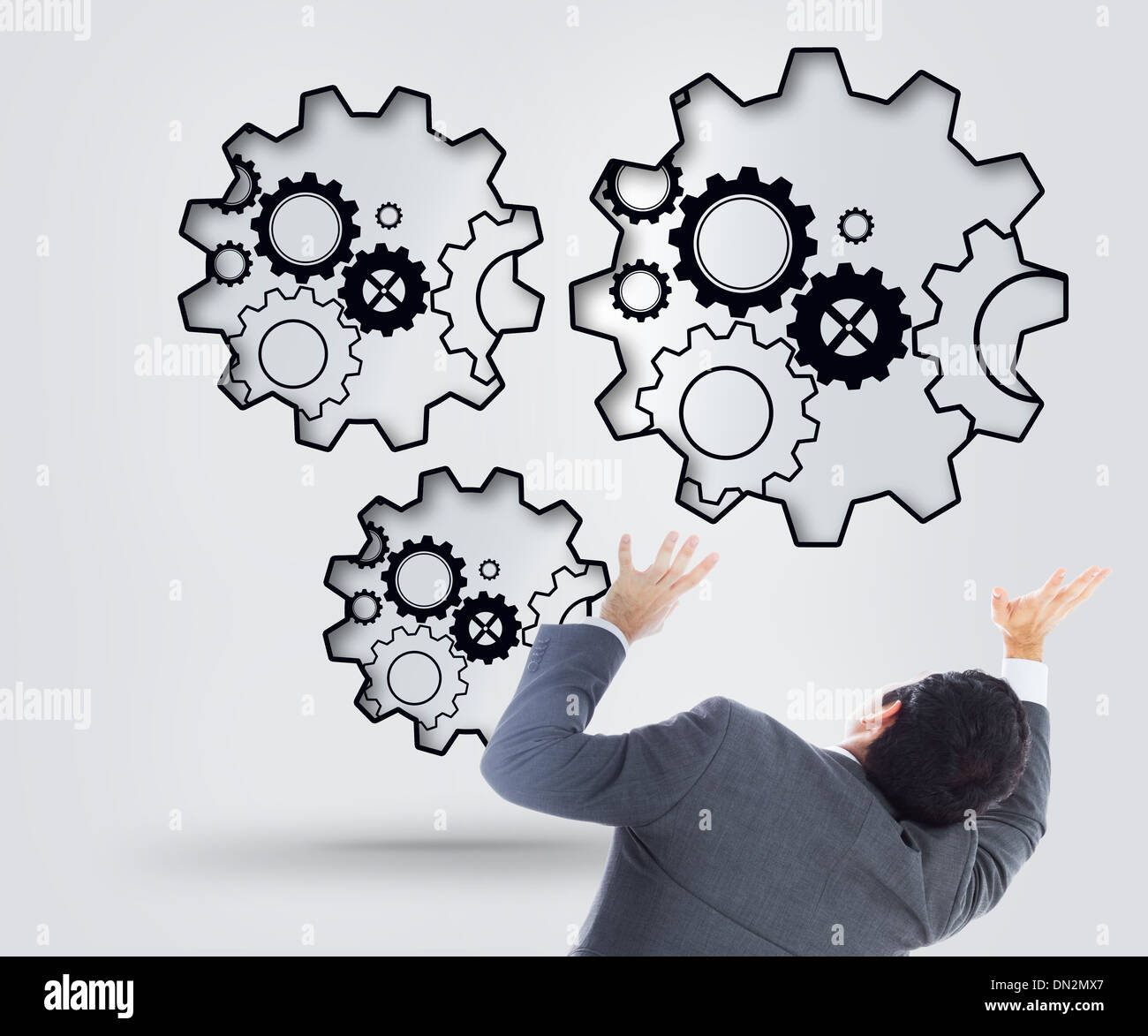 Composite image of businessman with arms raised Stock Photo - Alamy