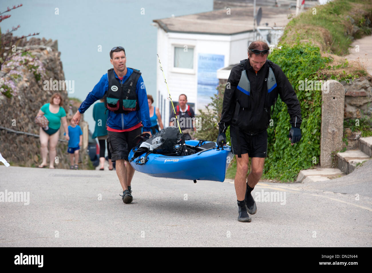 Men carrying Kayak Canoe Trevaunance Cove Cornwall Stock Photo - Alamy