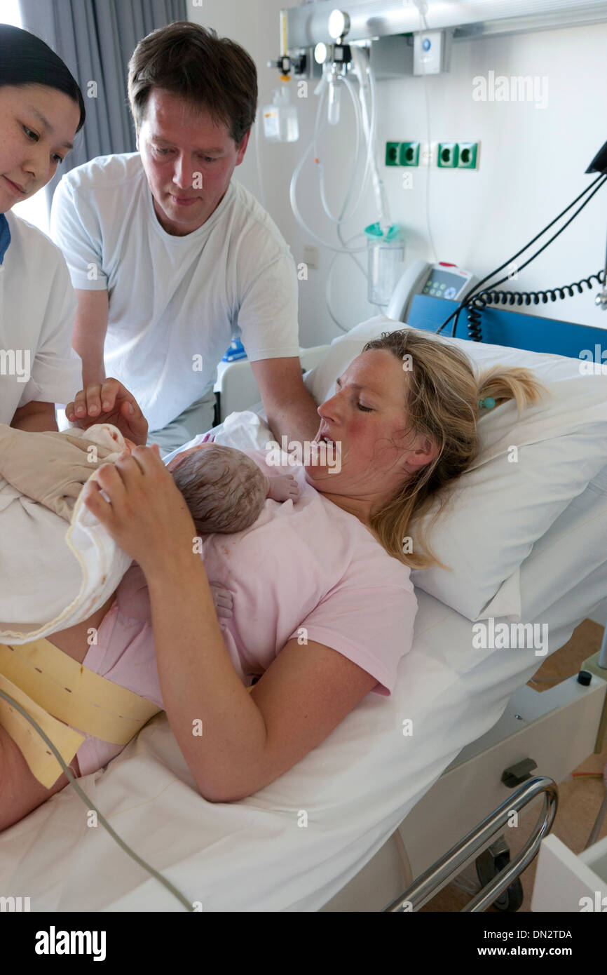 Parents with a newborn baby in hospital Stock Photo - Alamy