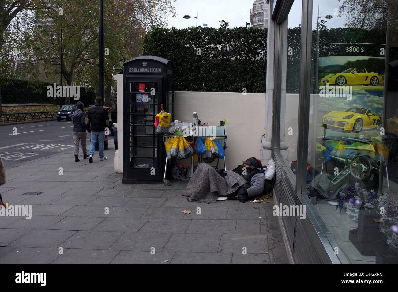 homeless man sleeping rough in park lane london UK 2013 Stock Photo - Alamy