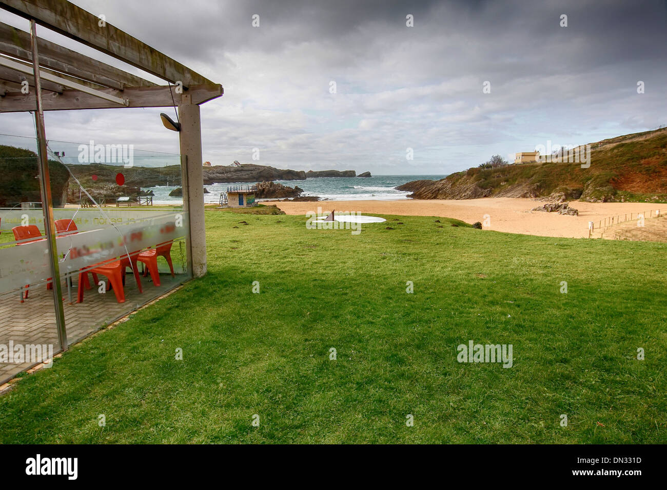 small beach with a glass building Stock Photo - Alamy