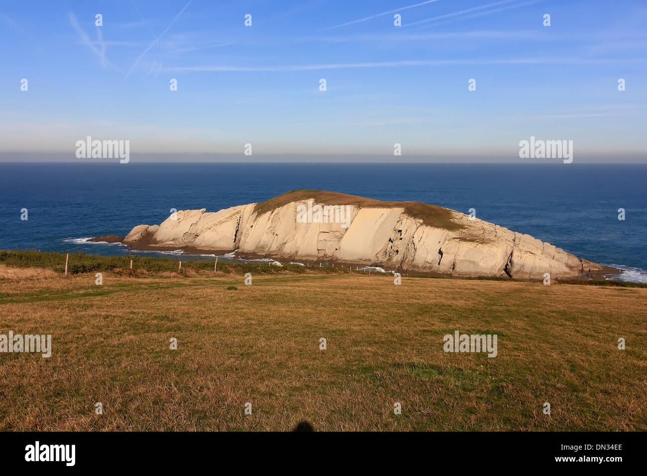 beautiful scenery of a lawn next to a large cliff Stock Photo - Alamy
