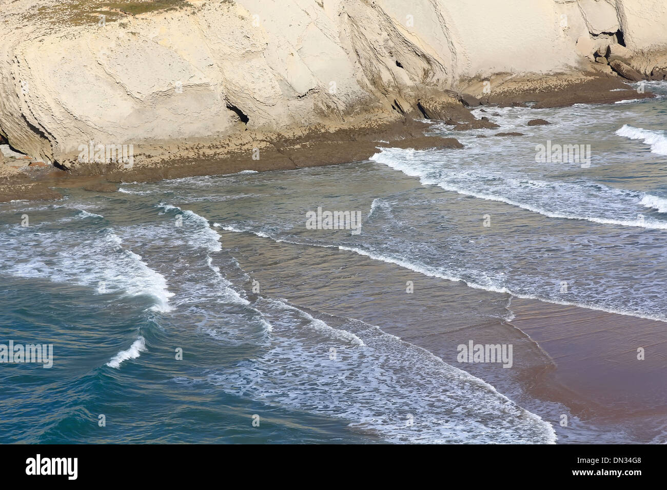 beautiful beach with waves and sea on two sides Stock Photo - Alamy