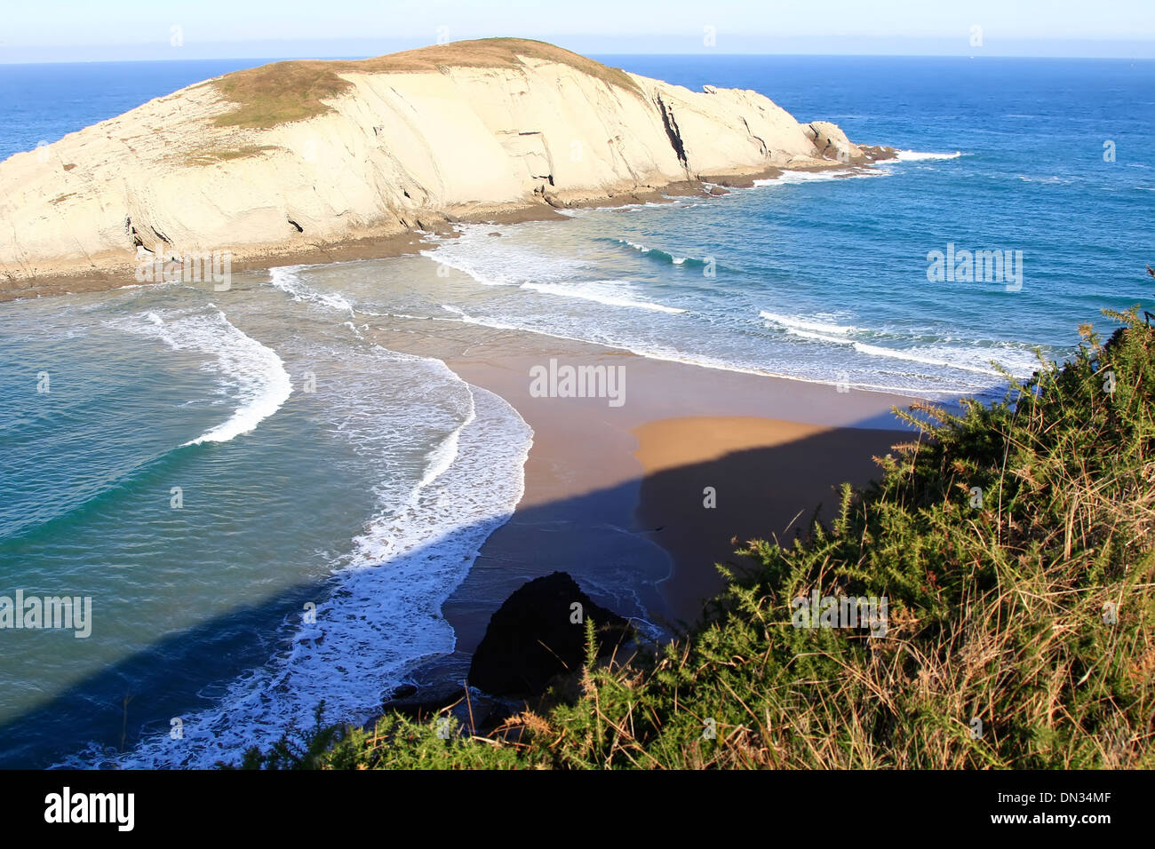 beautiful beach with waves and sea on two sides Stock Photo - Alamy