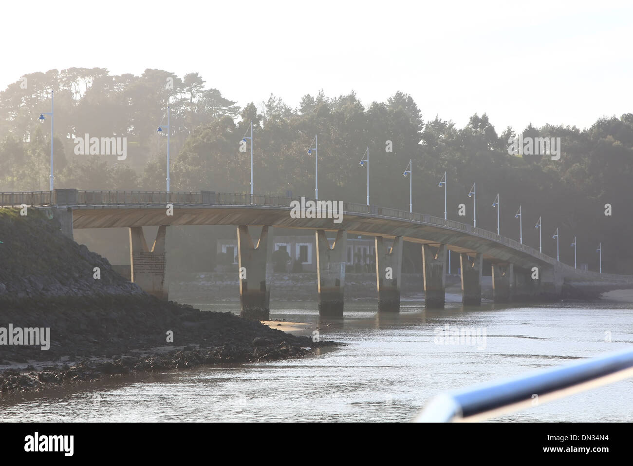 modern bridge over the outlet of a river Stock Photo - Alamy