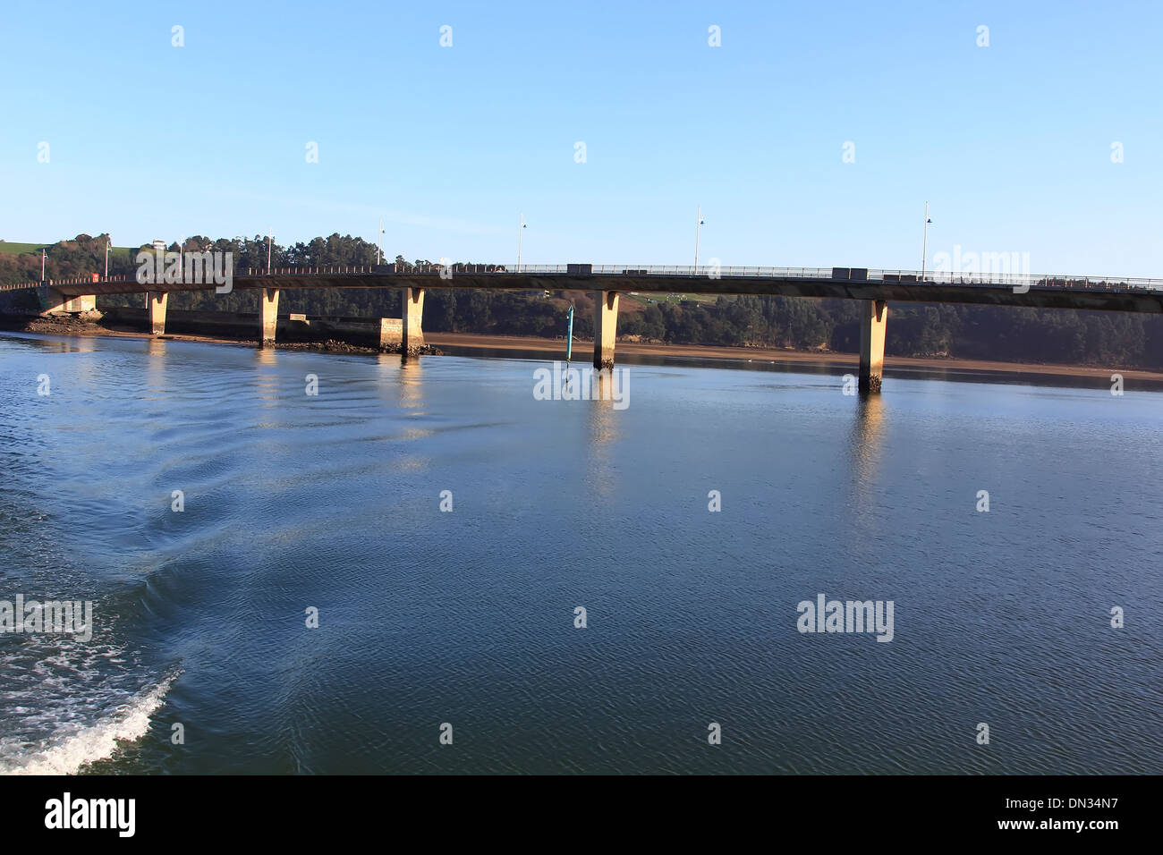 modern bridge over the outlet of a river Stock Photo - Alamy