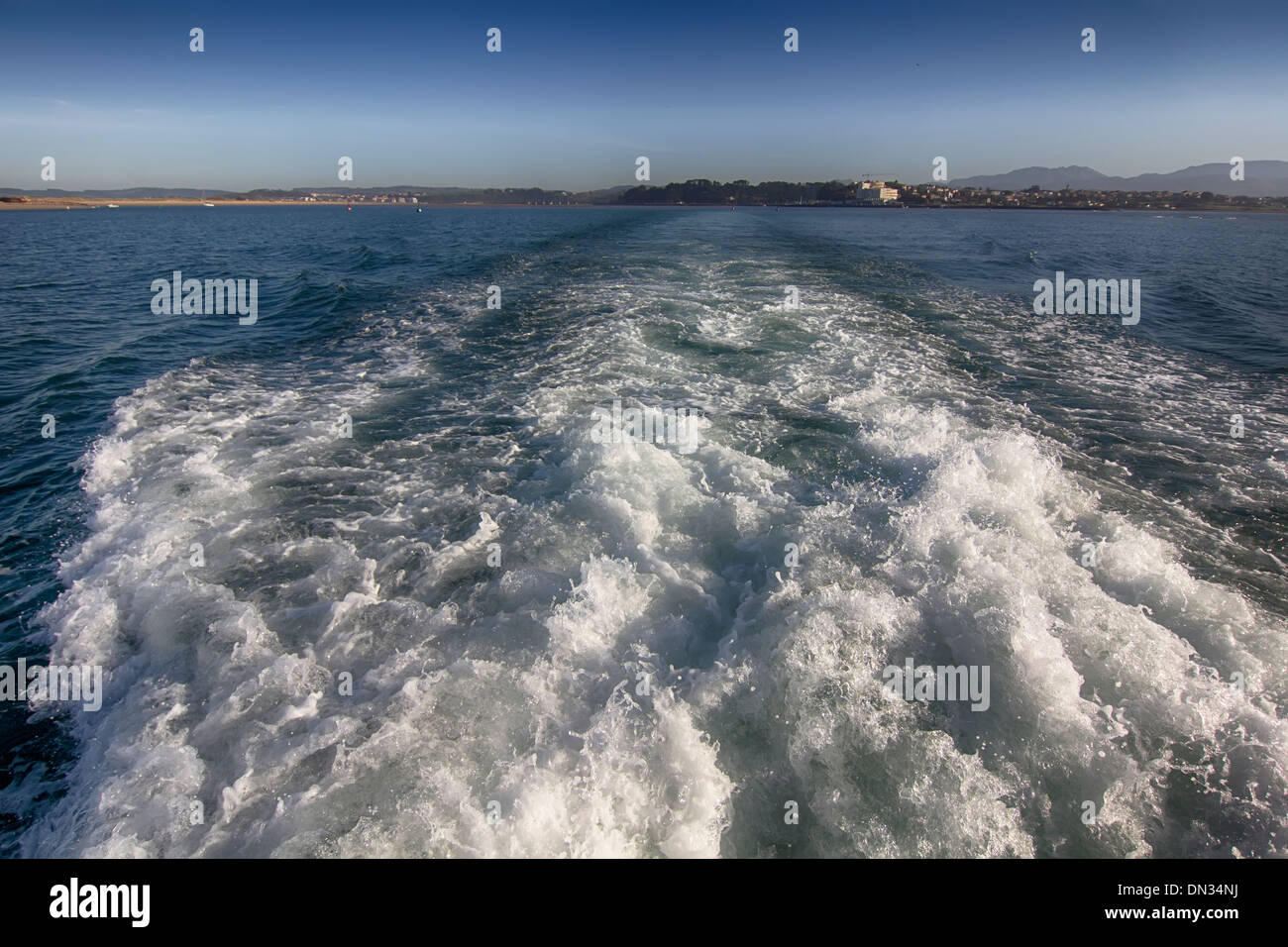 waves formed by the engine of a ship at sea Stock Photo - Alamy