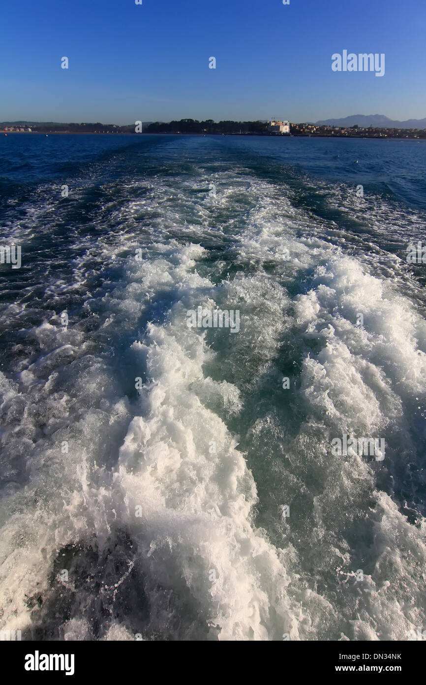 waves formed by the engine of a ship at sea Stock Photo - Alamy