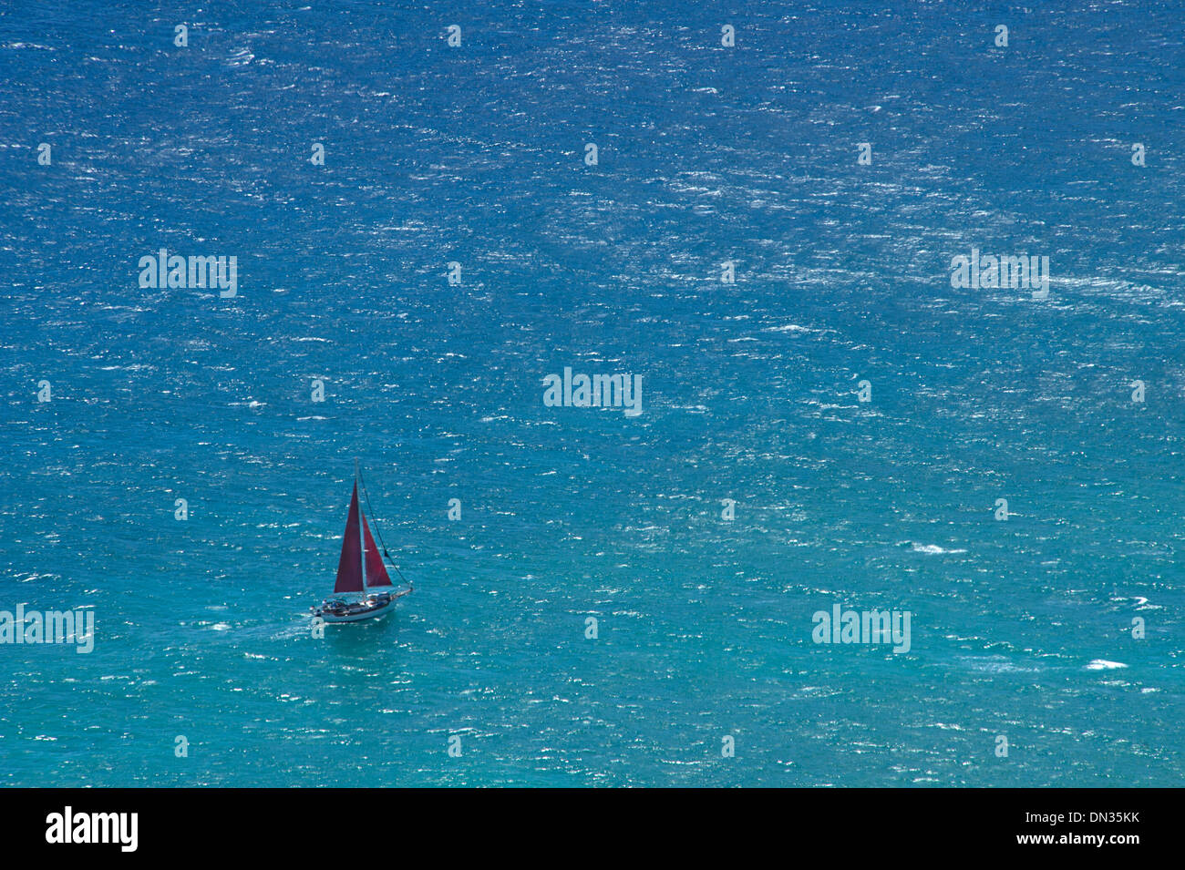Small yacht sailing in open ocean Stock Photo - Alamy